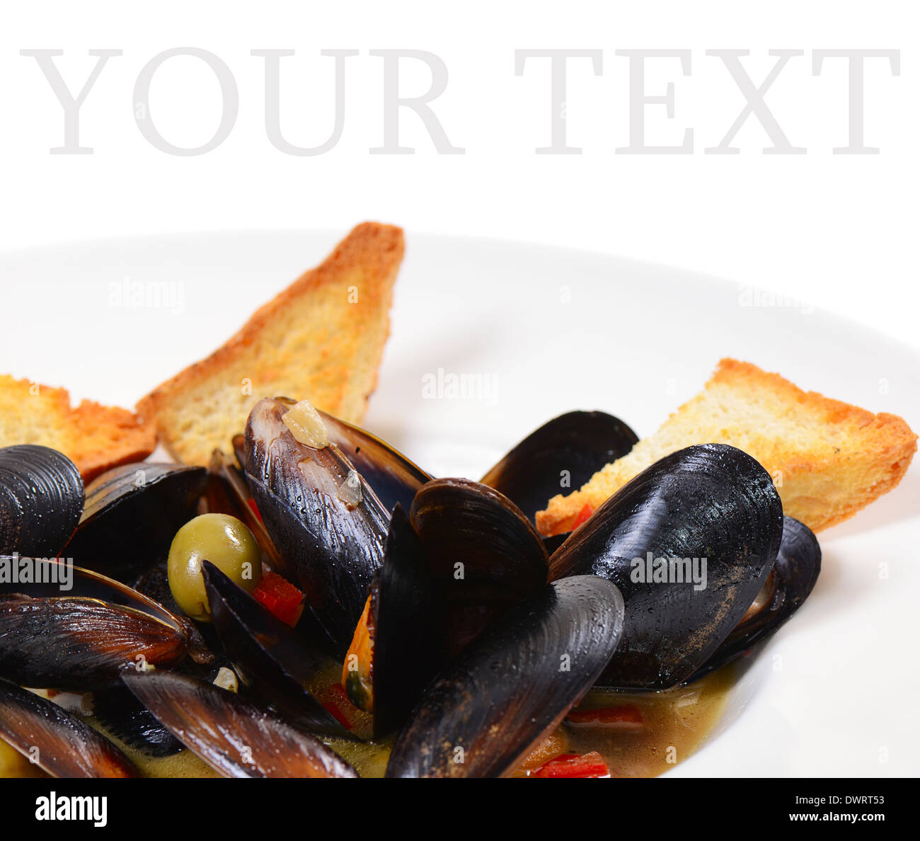 Mussels Tuscan with crispy ciabatta cloce up Stock Photo - Alamy