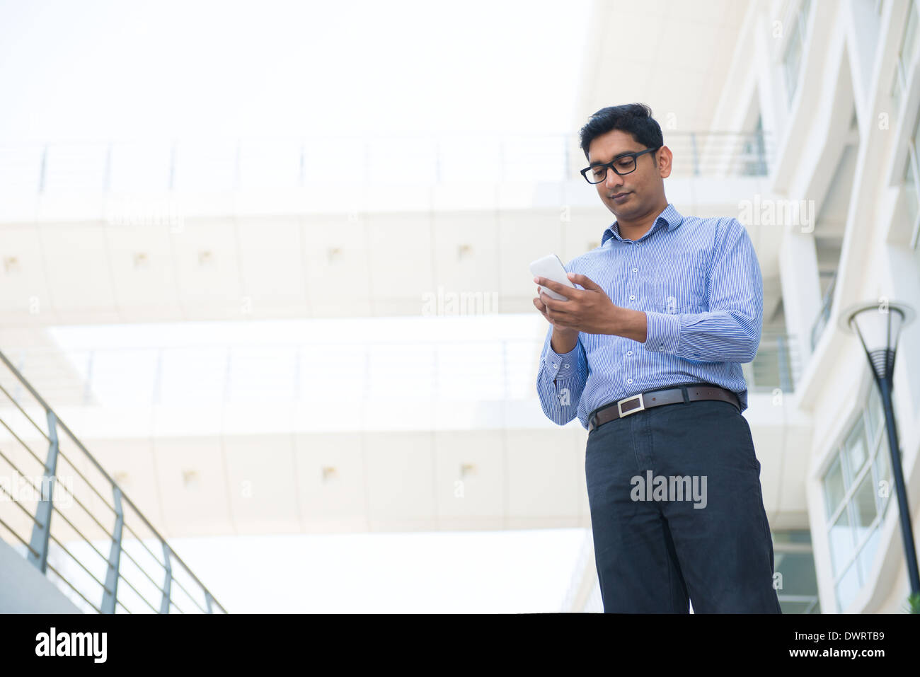 Indian man texting hi-res stock photography and images - Alamy