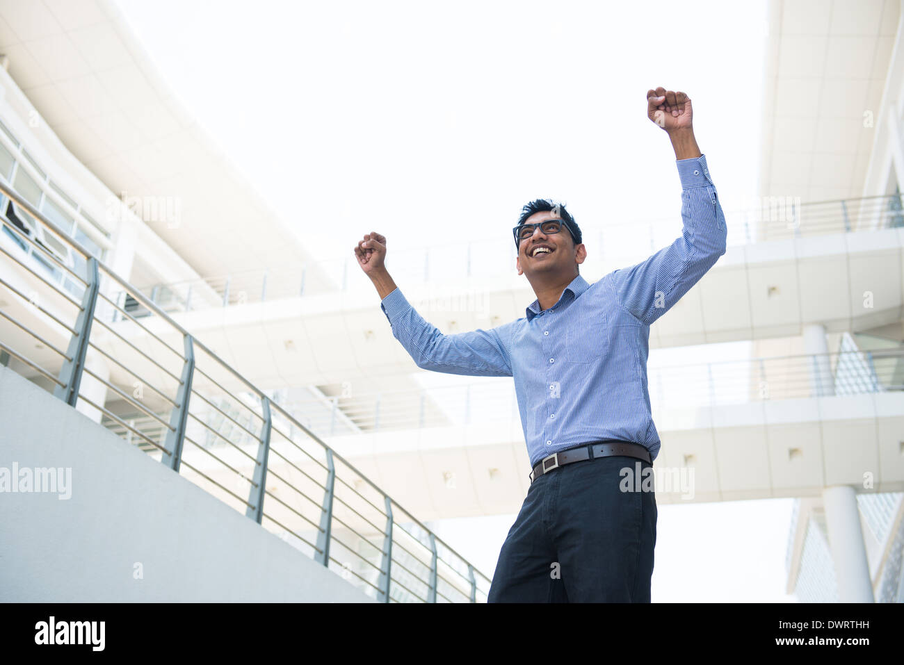 indian business male celebrating success with office background Stock ...