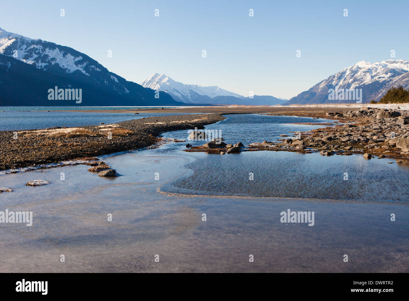 Water on the beach of the Chilkat inlet near Haines Alaska with ...