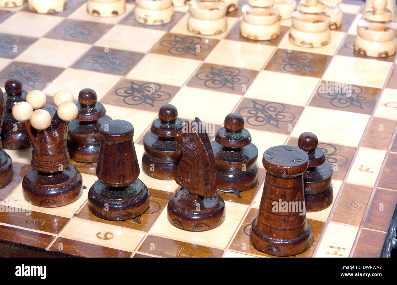 Black chess pieces on a chess board Stock Photo - Alamy