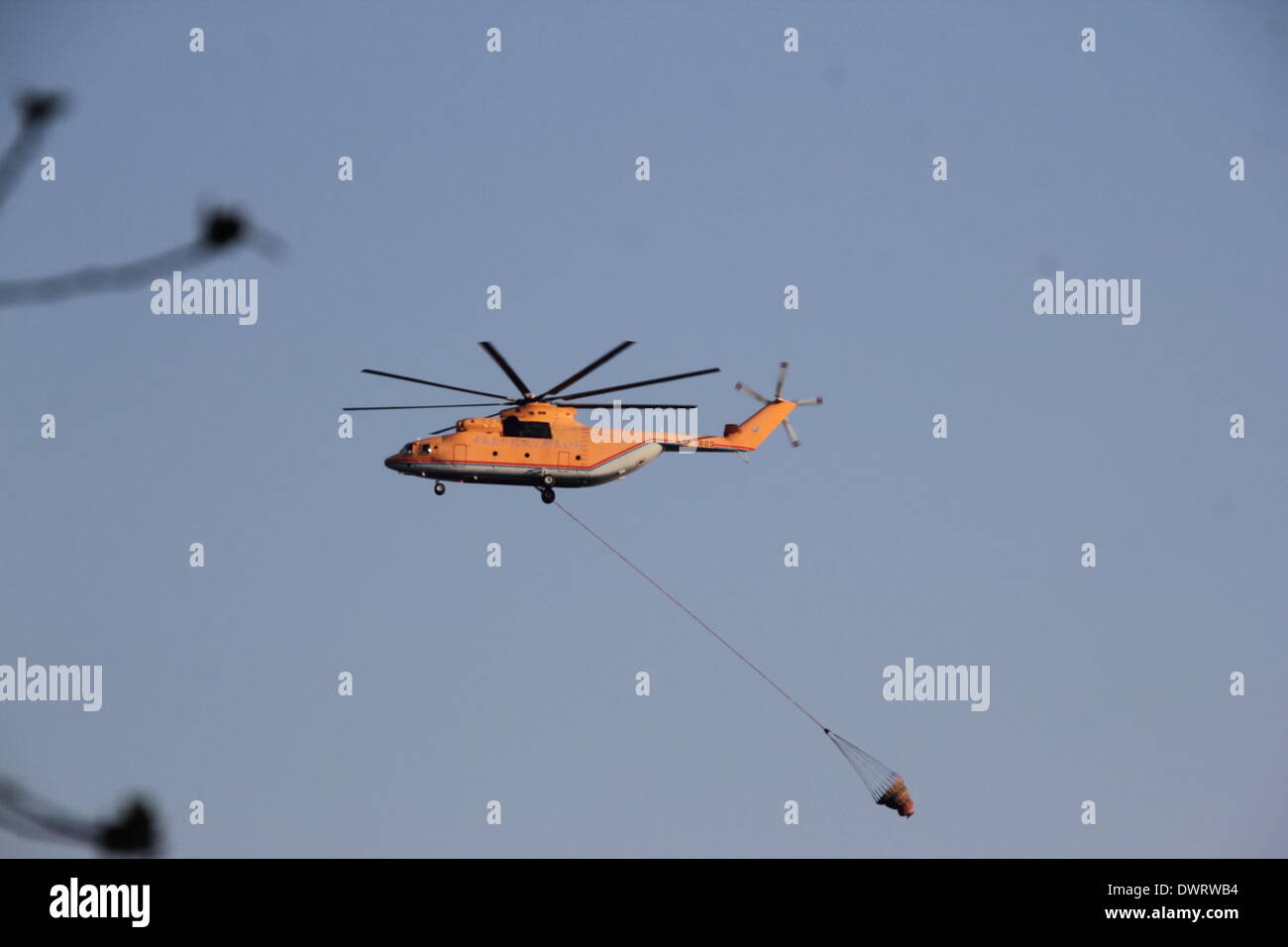 Lufeng, China's Yunnan Province. 13th Mar, 2014. A helicopter works at ...