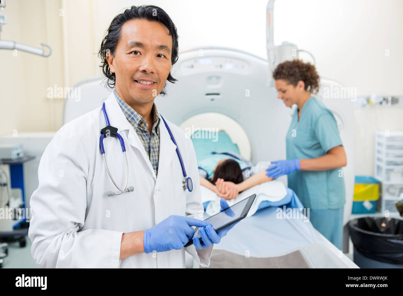 Doctor using machine during examination hi-res stock photography and ...