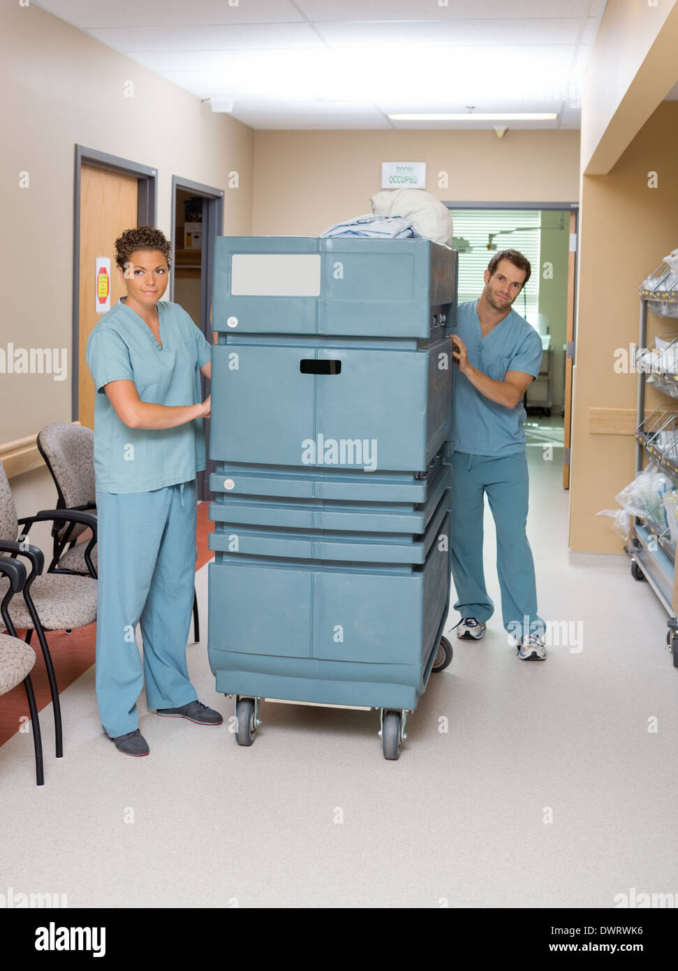 Nurses Pushing Trolley In Hospital Hallway Stock Photo - Alamy