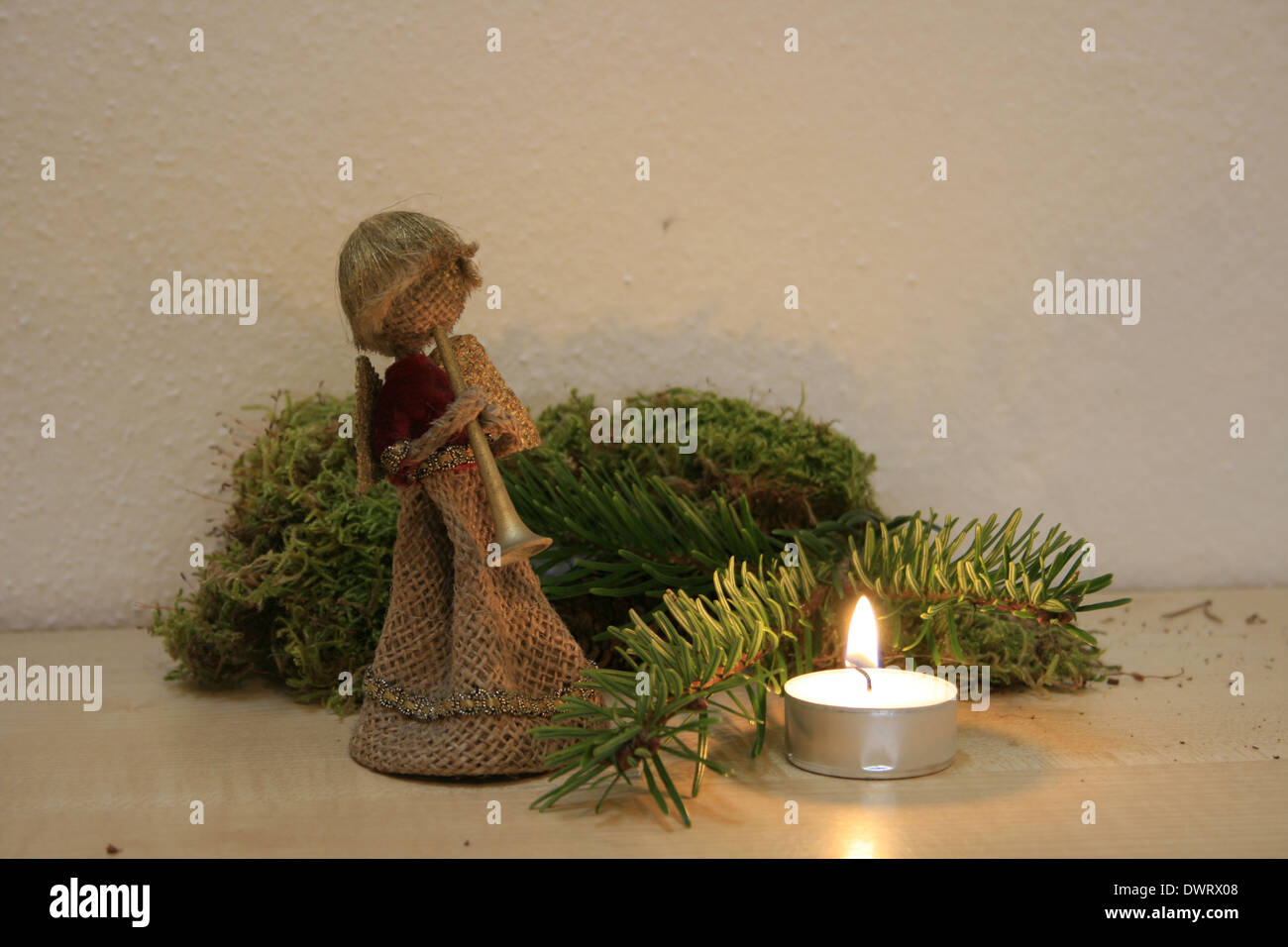two Christmas angles, candle, Christmas ceiling, pine branches, moss ...
