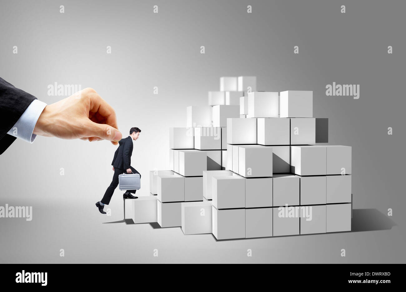 a hand pushing businessman to climb up the boxes Stock Photo - Alamy