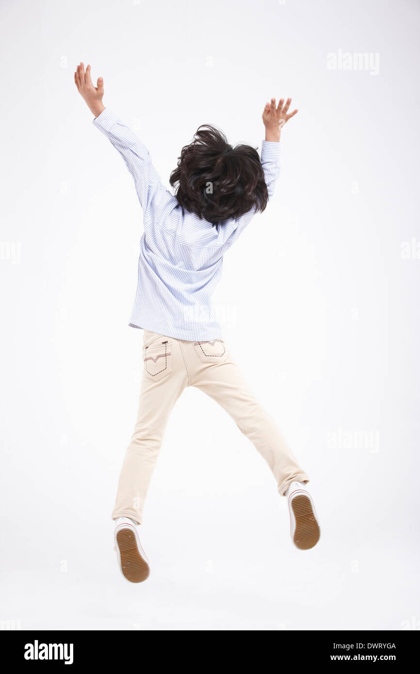 a kid jumping in white background Stock Photo - Alamy