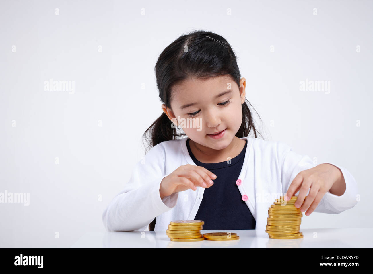 close up shot of a kid with gold coins Stock Photo - Alamy