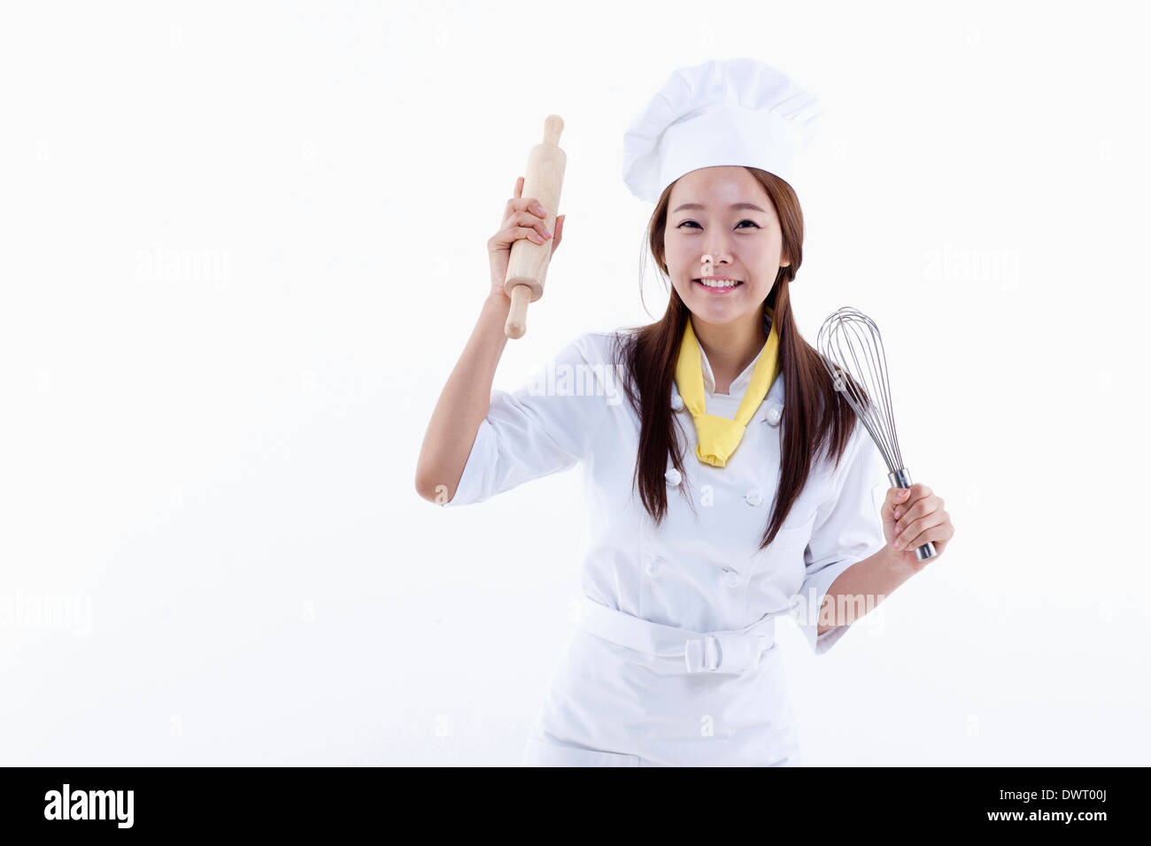 a female posing with utensils in professional cook outfit Stock Photo ...