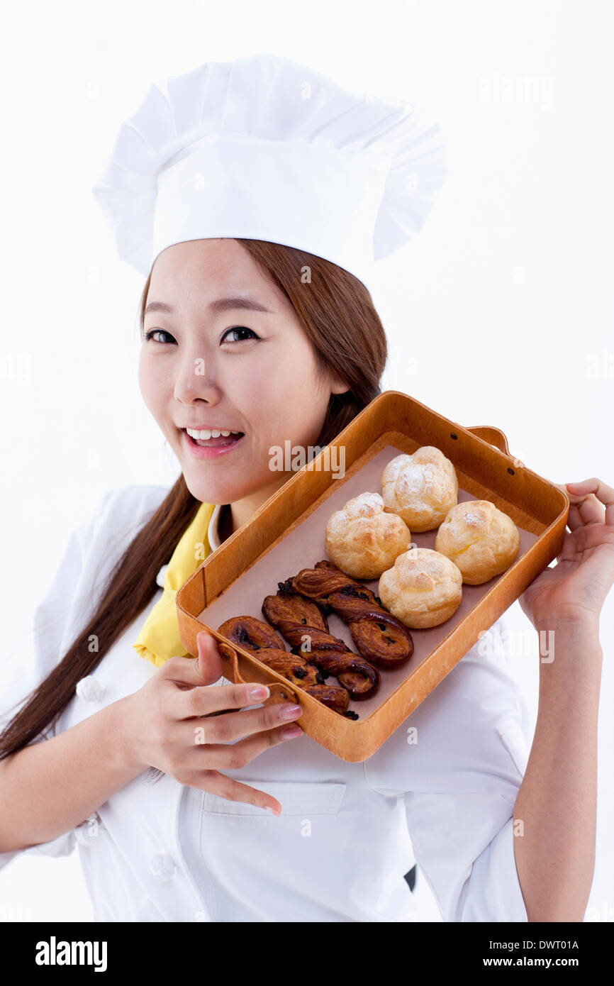 Chef smiling holding box hi-res stock photography and images - Alamy