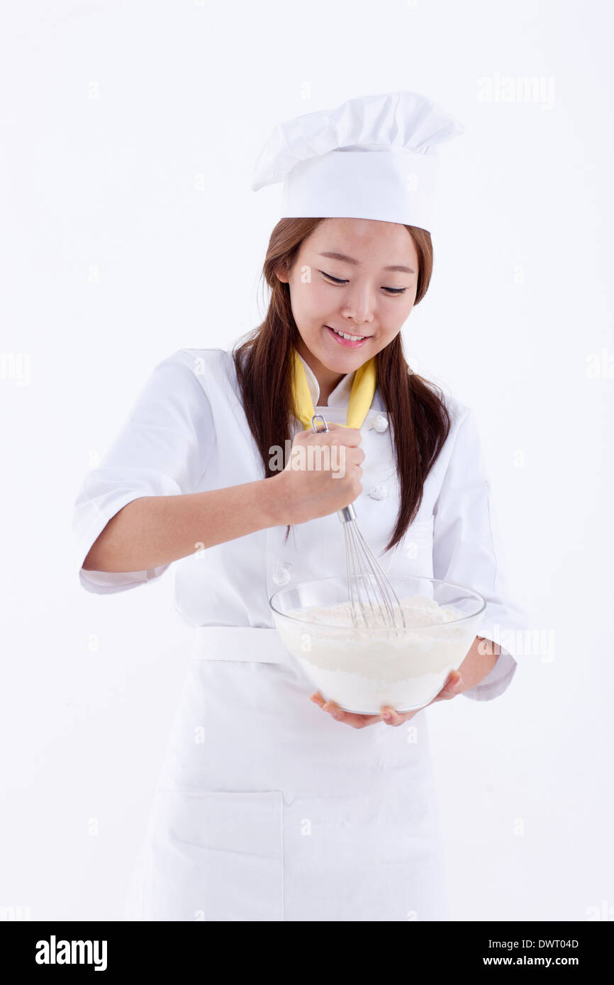a female pastry chef mixing the flour Stock Photo - Alamy