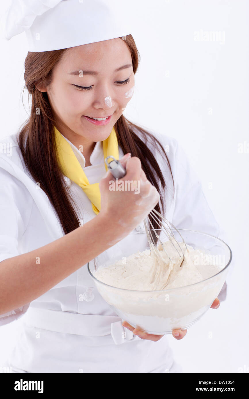 close up shot of a female pastry chef mixing the flour Stock Photo - Alamy