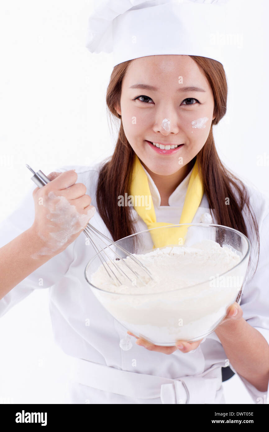 close up shot of a female pastry chef mixing the flour Stock Photo - Alamy