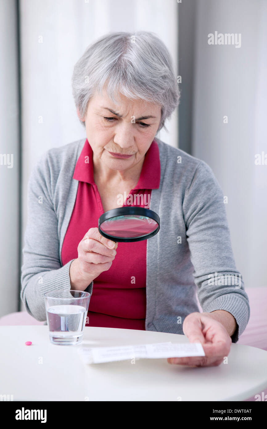 Elderly person taking medication Stock Photo - Alamy
