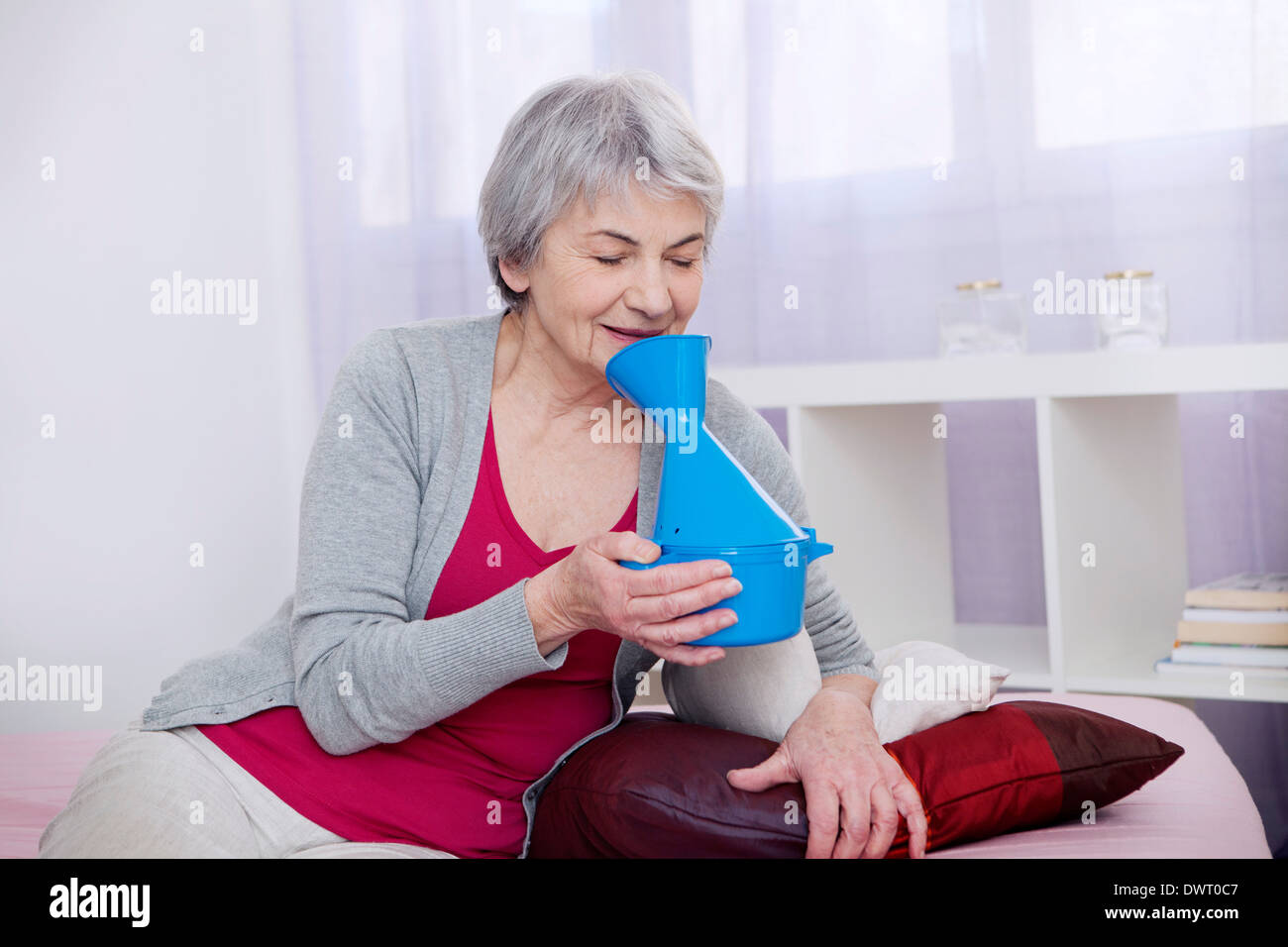 Elderly person taking inhalation Stock Photo - Alamy