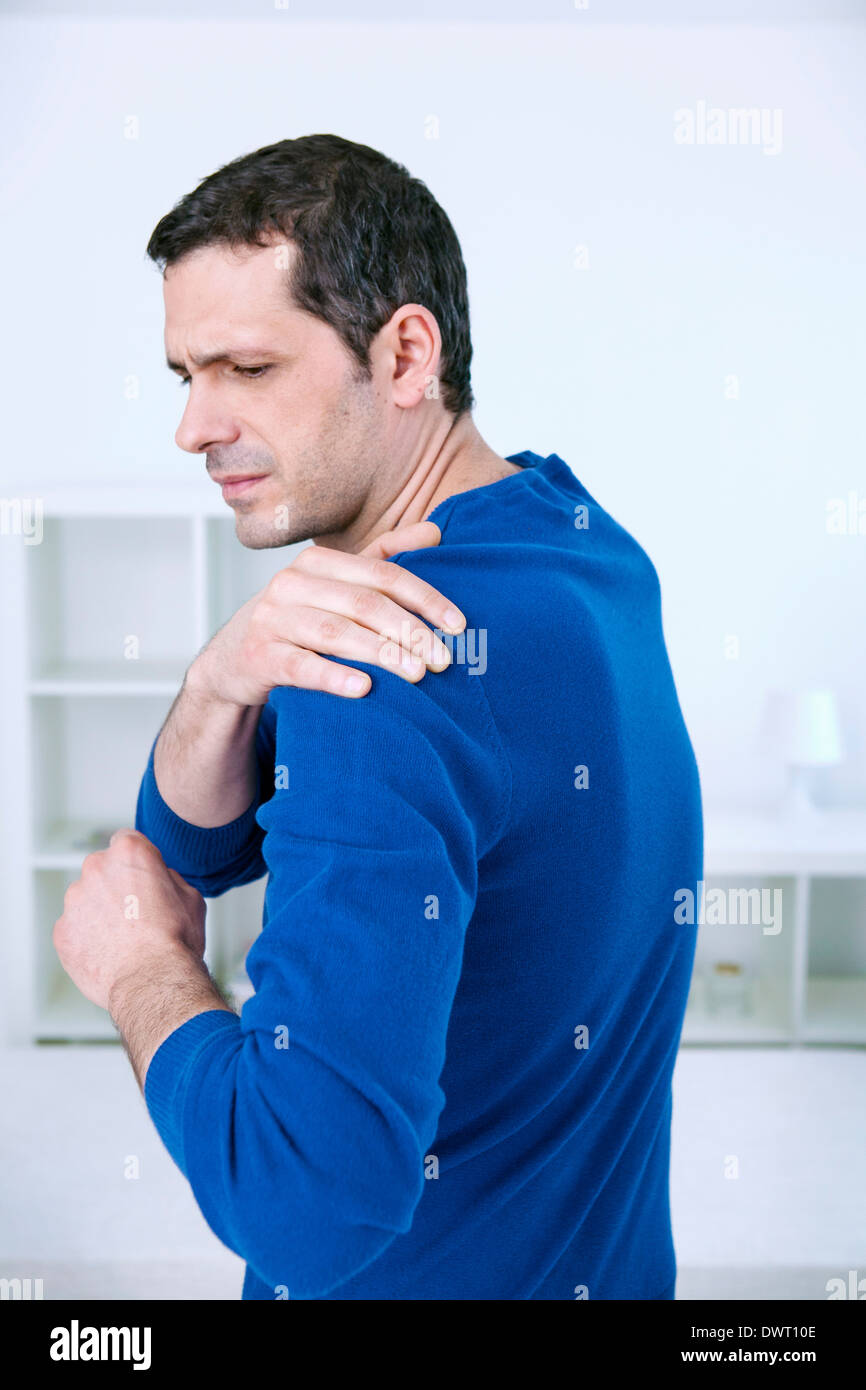 Shoulder pain in a man Stock Photo - Alamy