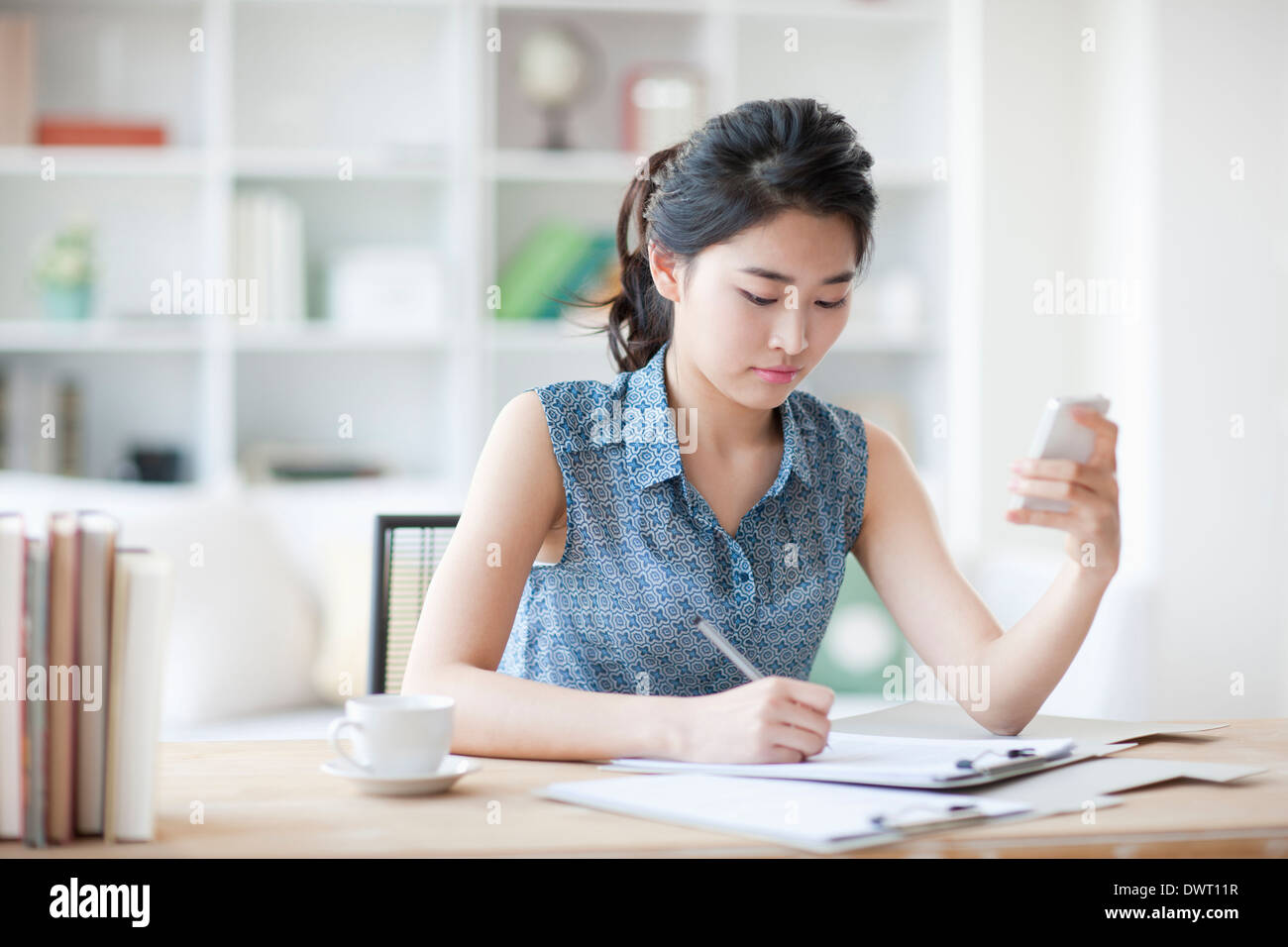 Woman desk catching up hi-res stock photography and images - Alamy