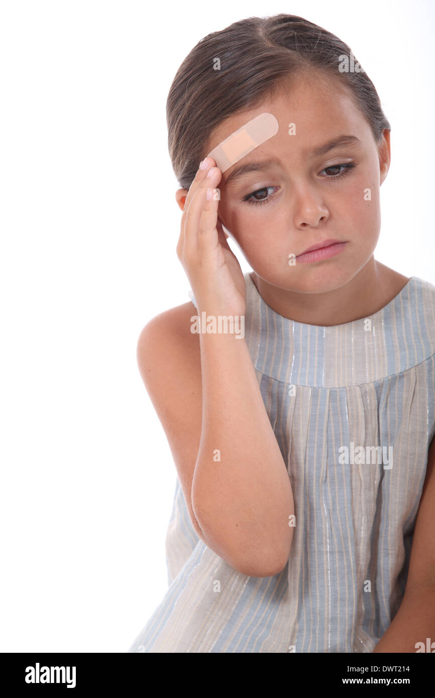 Girl with plaster on head Stock Photo - Alamy