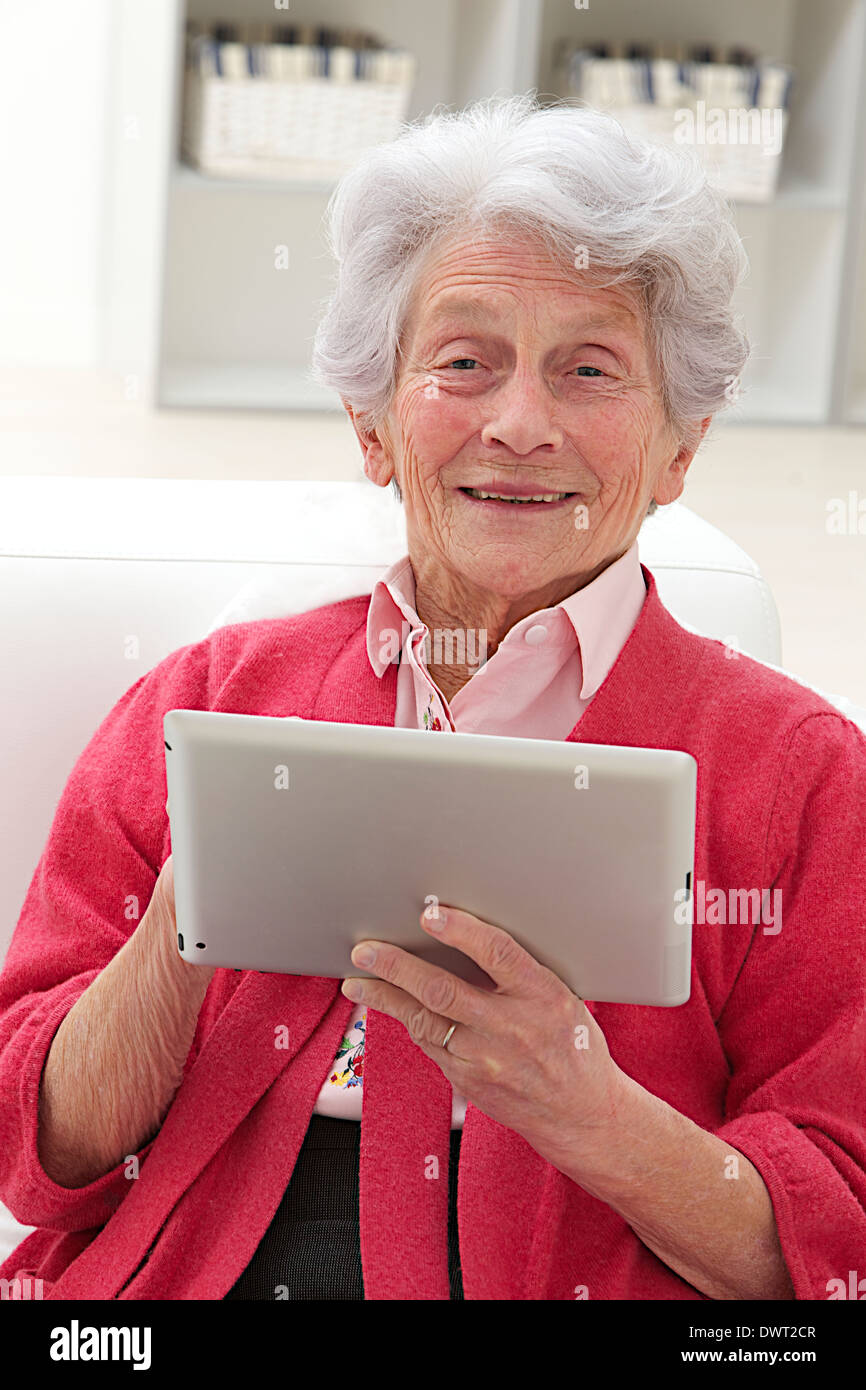 Elderly person with tablet Stock Photo - Alamy