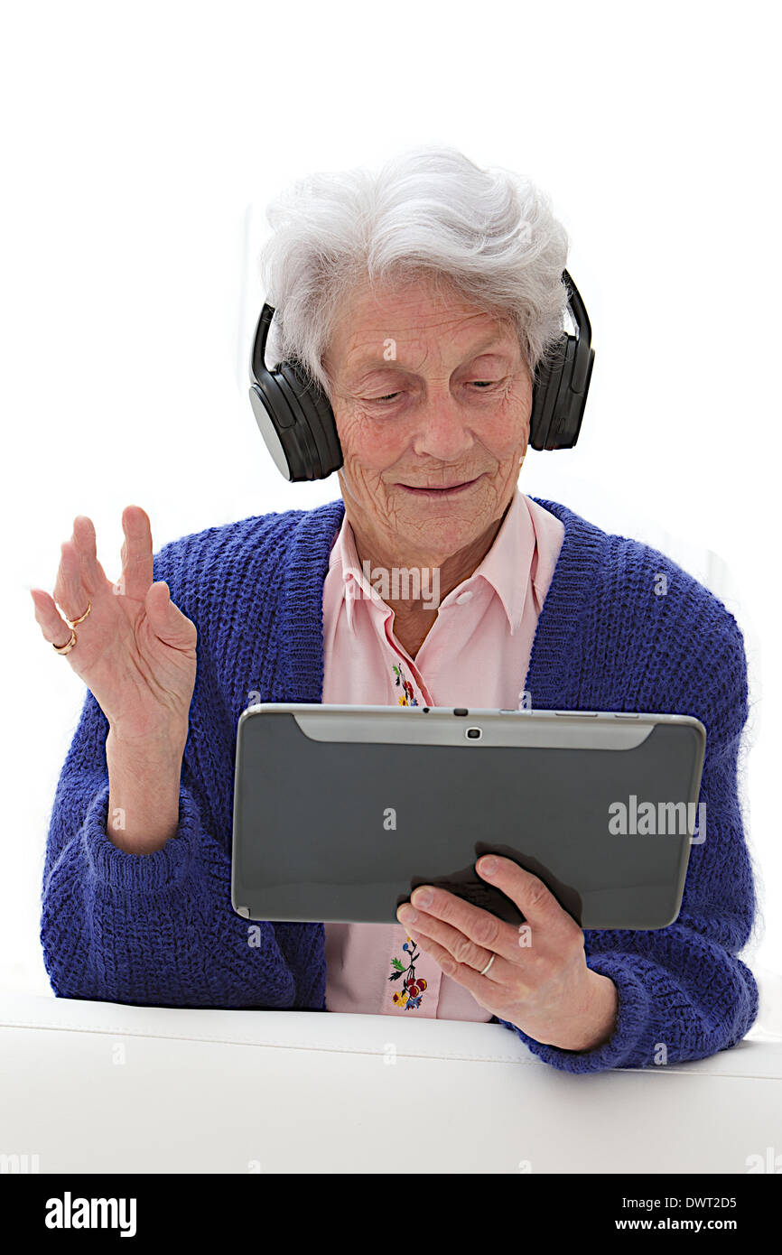Elderly person with tablet Stock Photo - Alamy