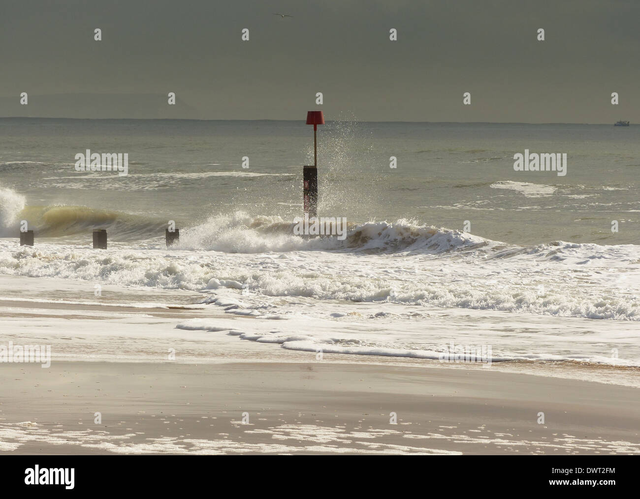 Bournemouth seafront with groyne and incoming tide Stock Photo - Alamy