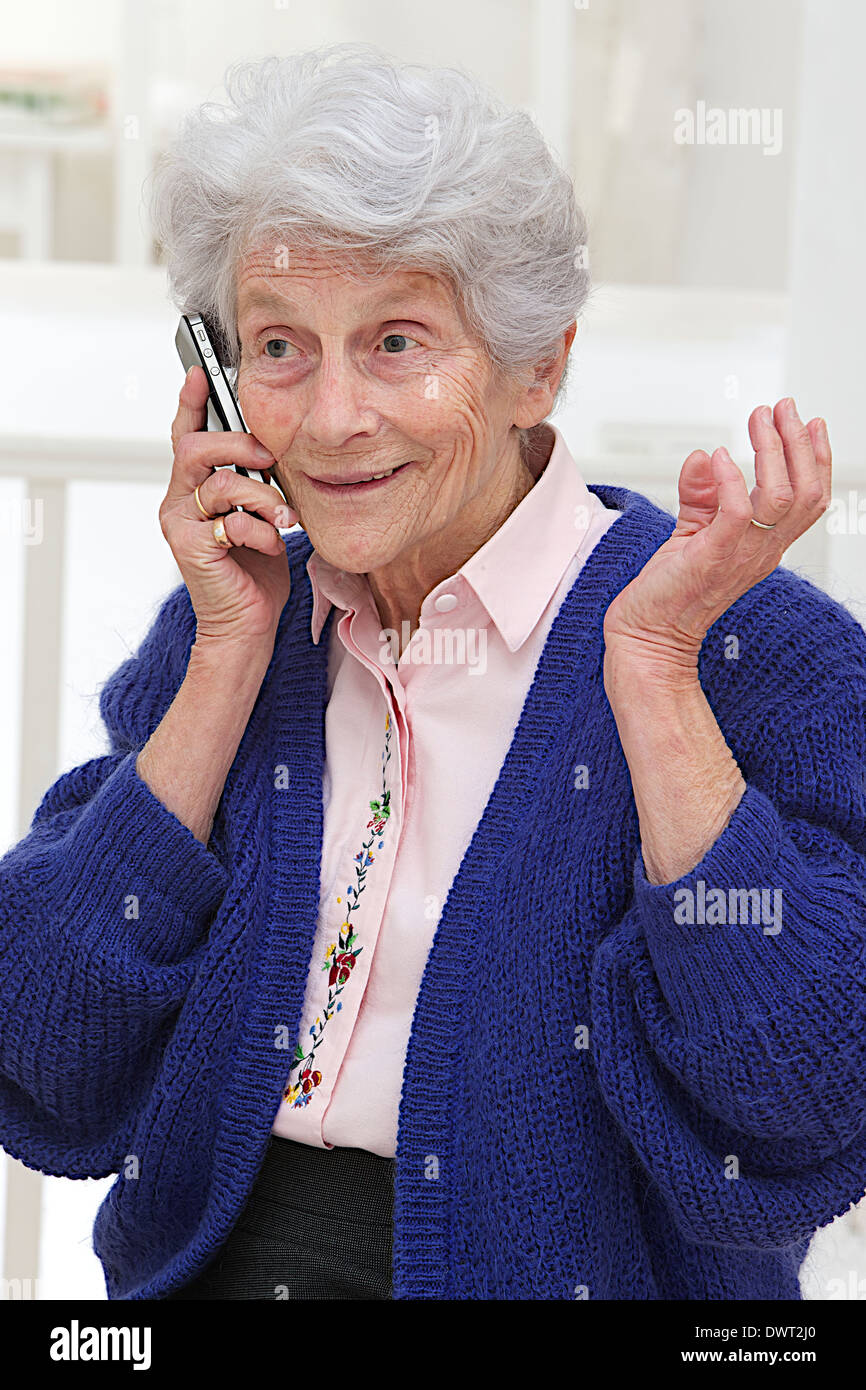 Elderly person on the phone Stock Photo - Alamy