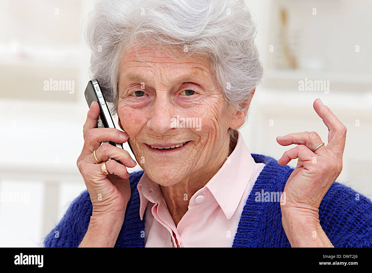 Elderly person on the phone Stock Photo - Alamy