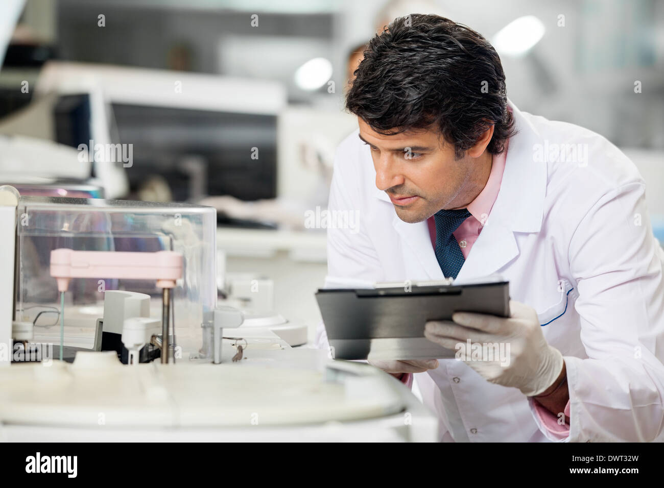 Scientist Observing Experiment Stock Photo - Alamy