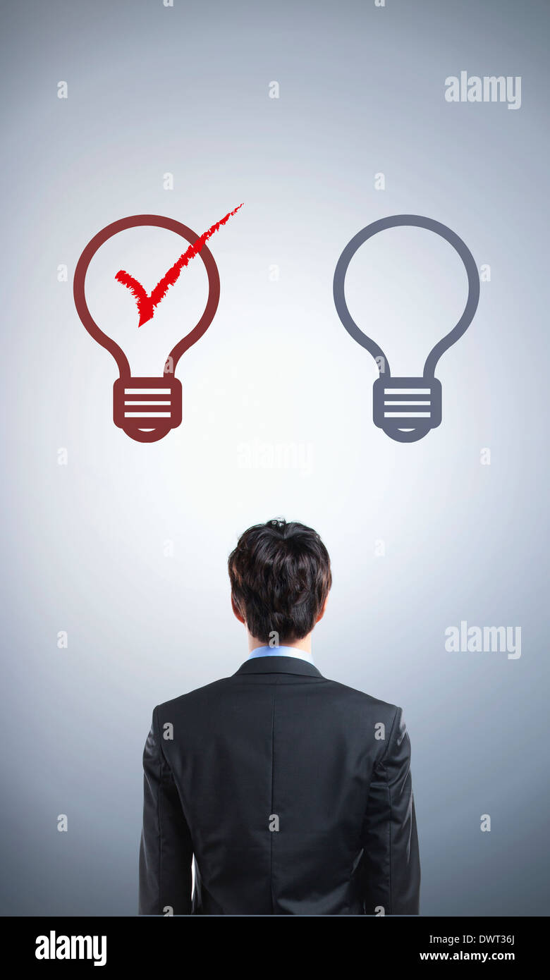 a business man choosing the right idea Stock Photo - Alamy