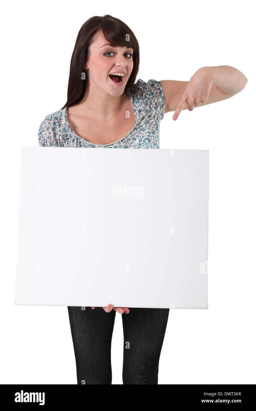 young woman pointing at a blank board Stock Photo - Alamy