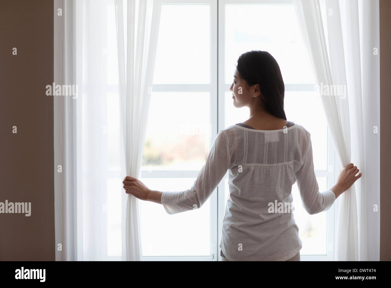 Person behind curtain hi-res stock photography and images - Alamy