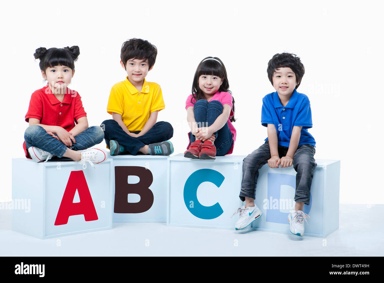 Kids sitting on alphabet blocks hi-res stock photography and images - Alamy