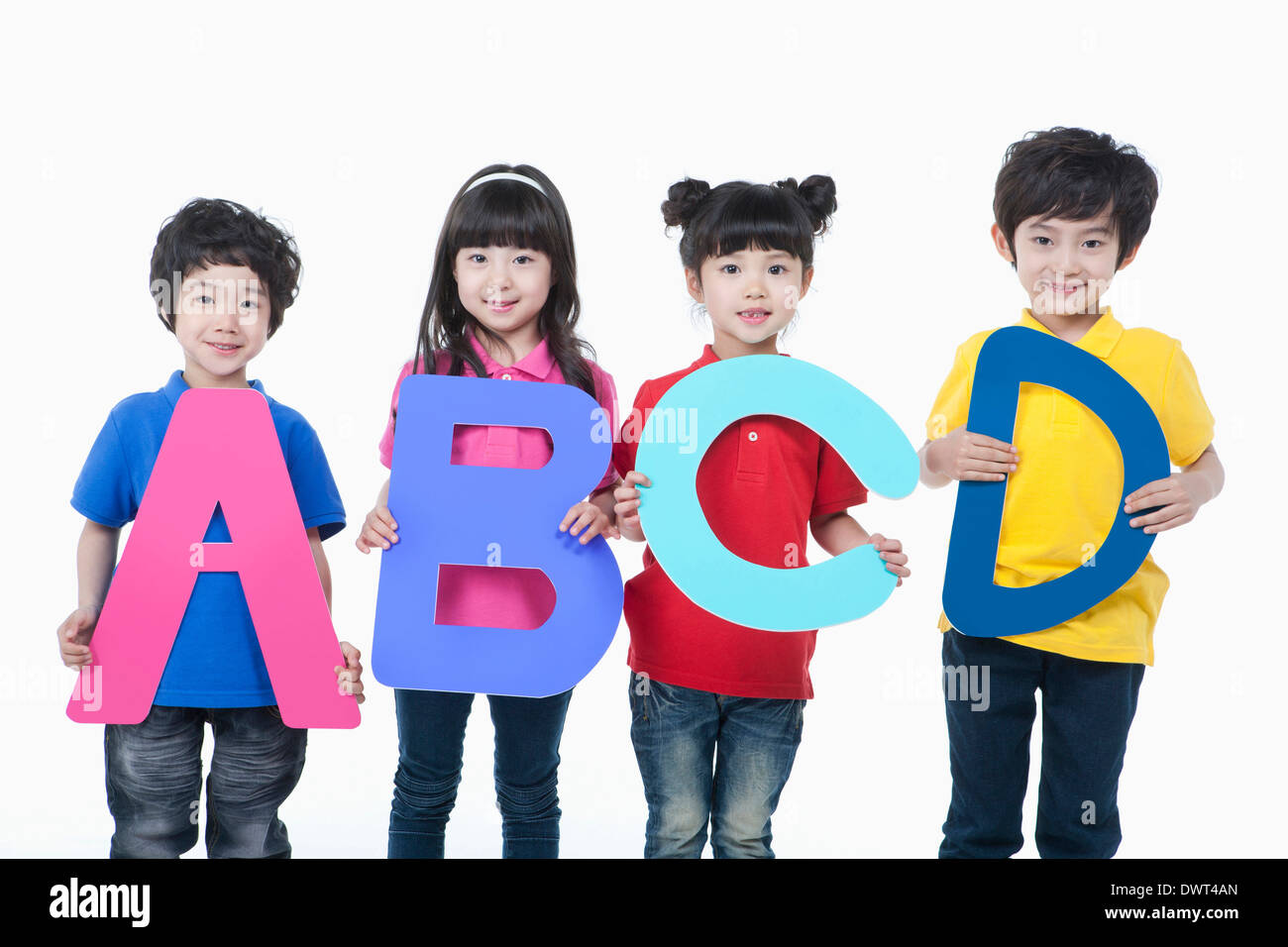 Children holding alphabet letters hi-res stock photography and images ...