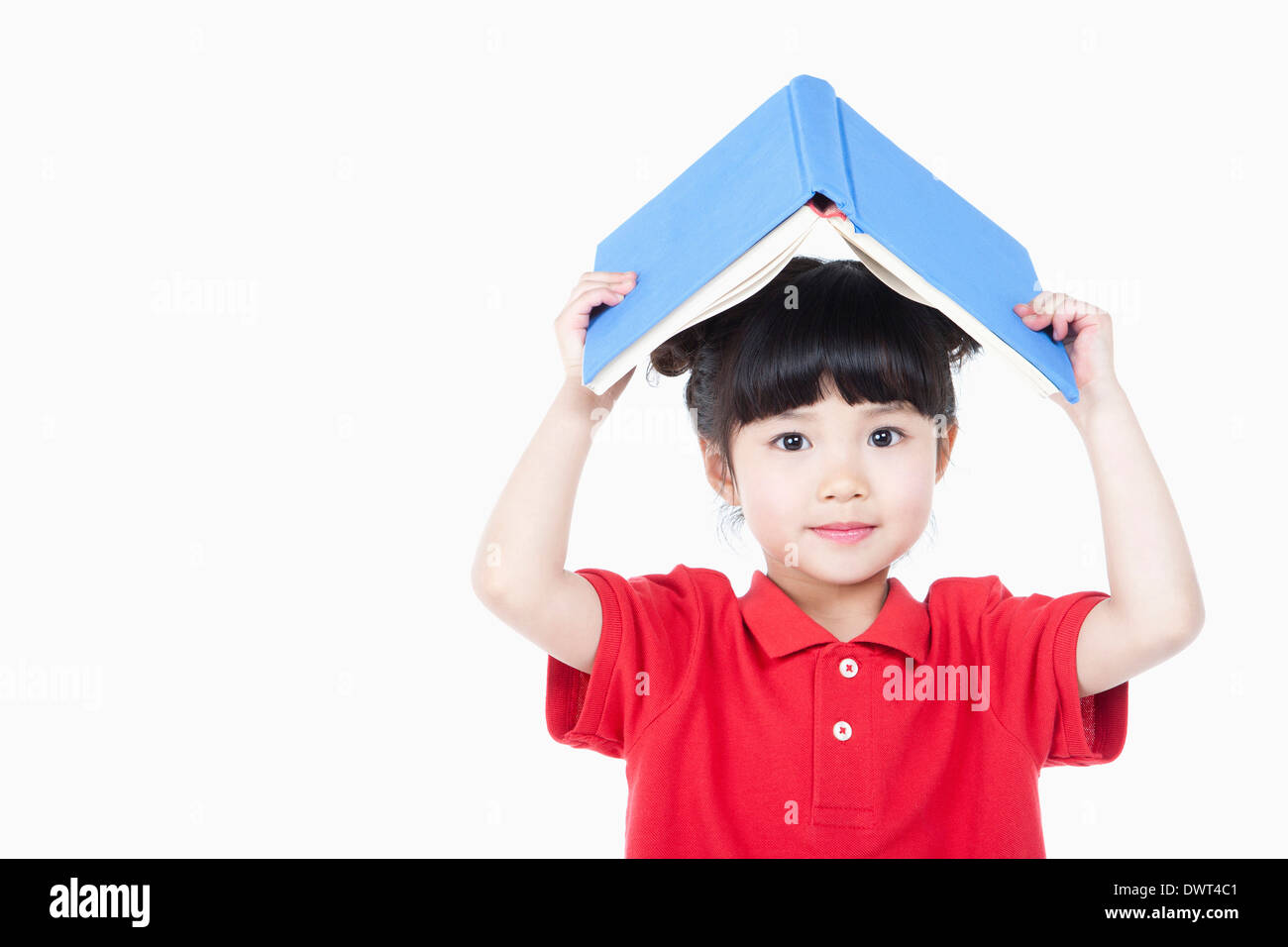 Kid holding a book hi-res stock photography and images - Alamy