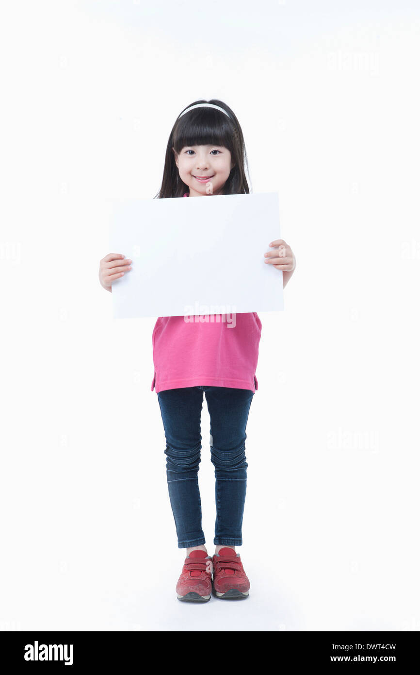 a kid holding a blank paper Stock Photo - Alamy