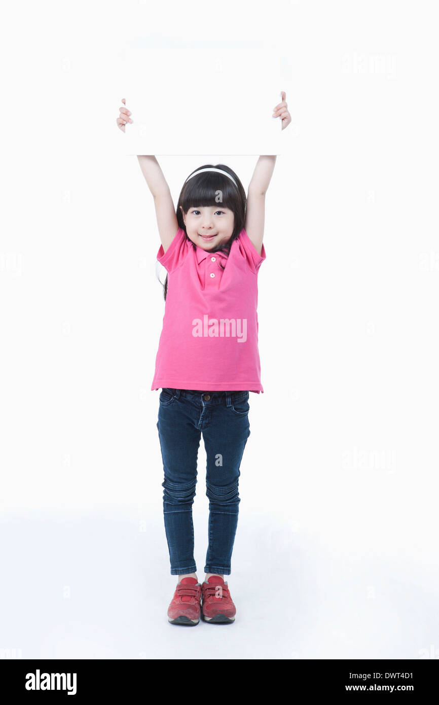 a kid holding a blank paper Stock Photo - Alamy