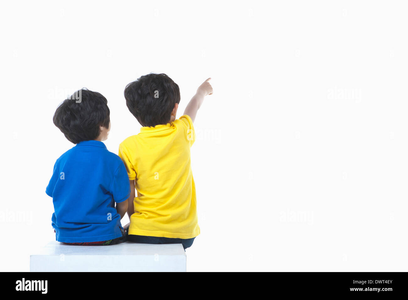 back shot of kids looking somewhere together Stock Photo - Alamy