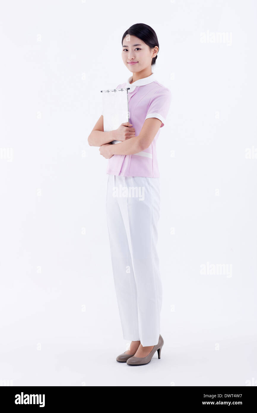 a nurse posing with a patient chart Stock Photo - Alamy