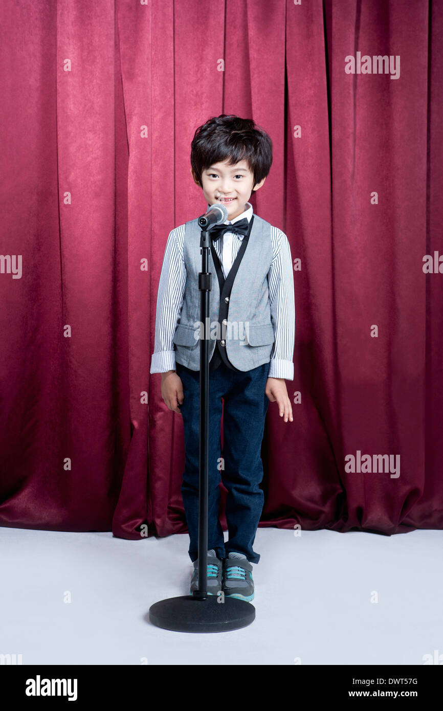 a boy performing on stage Stock Photo - Alamy