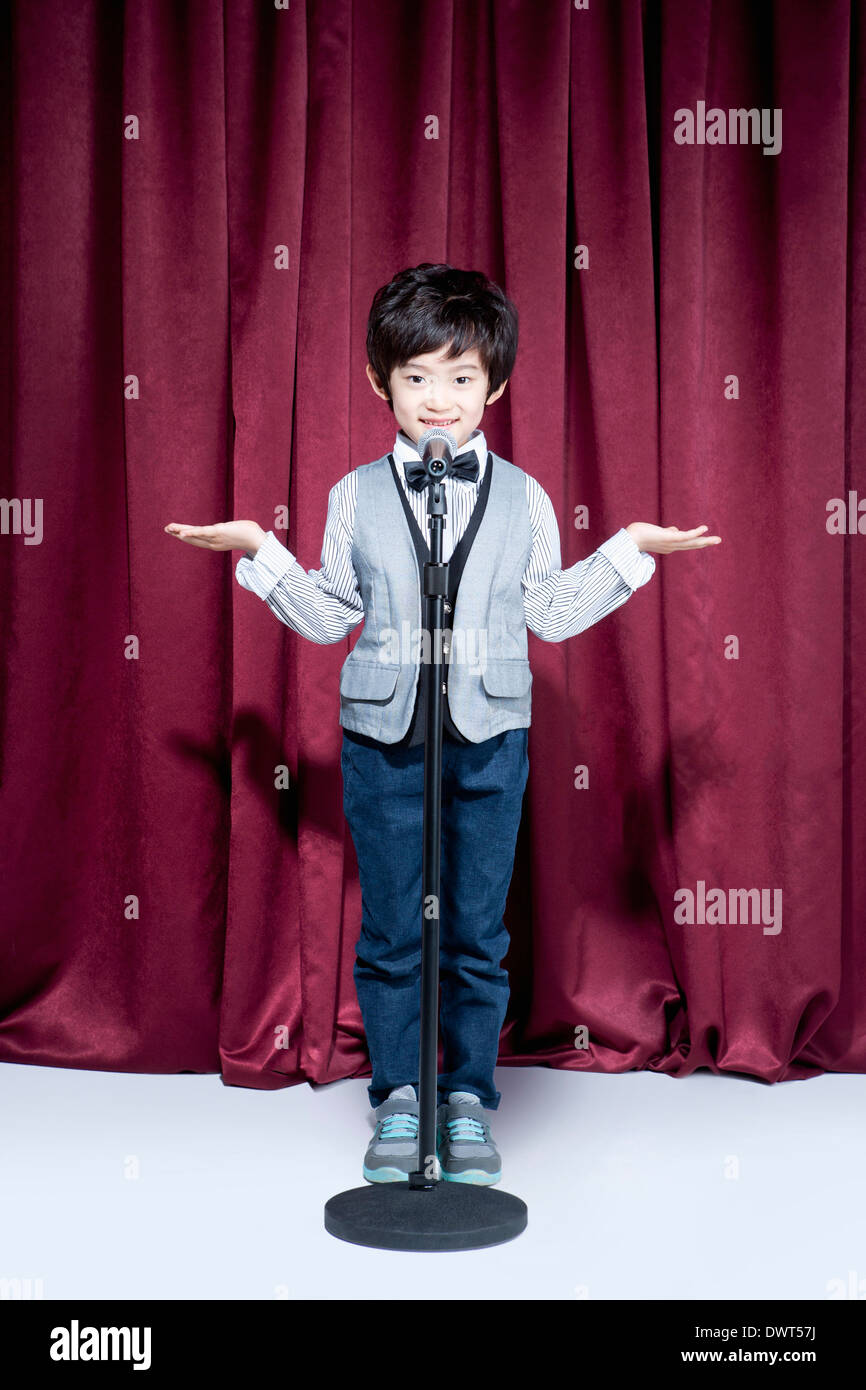 a boy performing on stage Stock Photo - Alamy