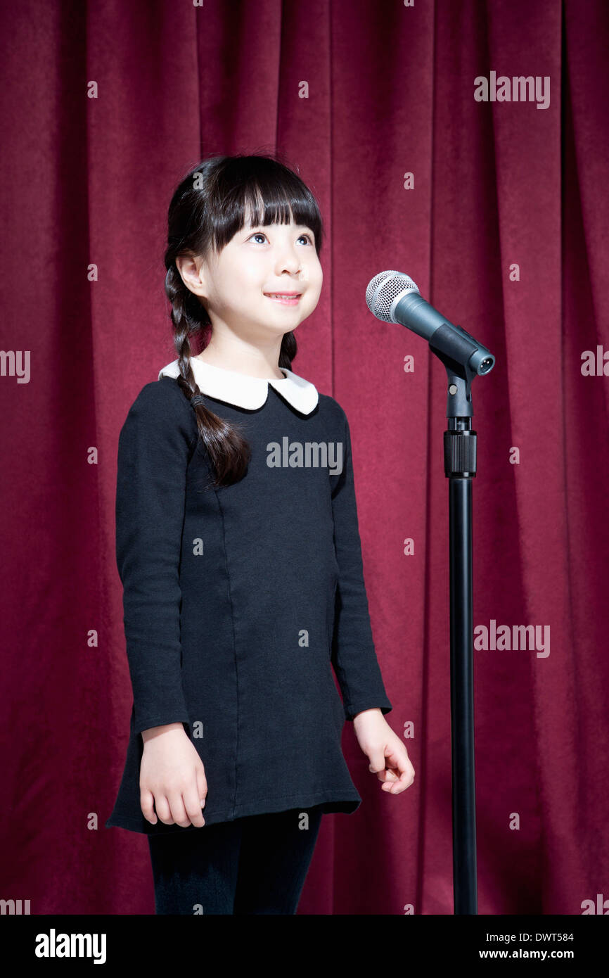 a girl performing on stage Stock Photo - Alamy