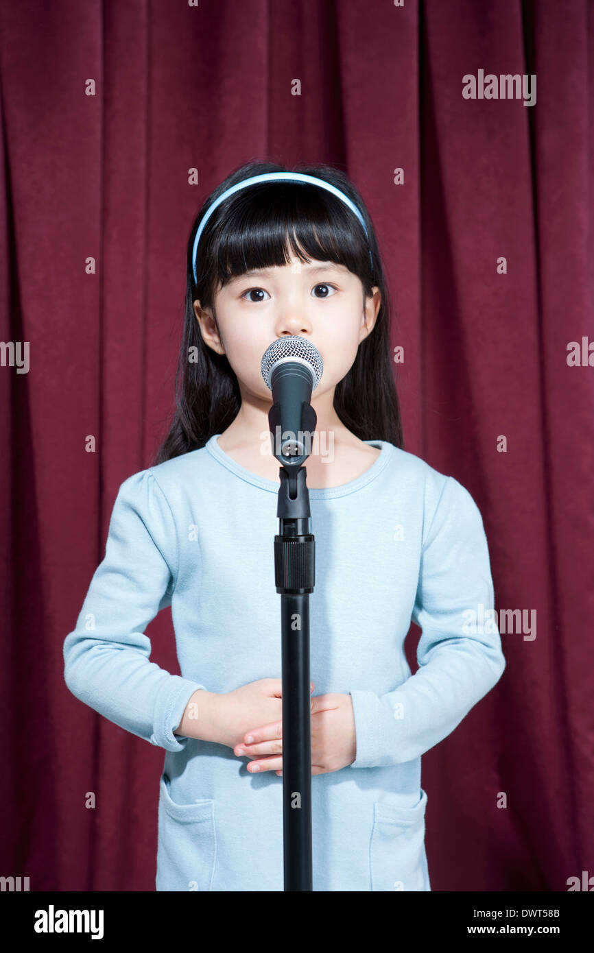a girl performing on stage Stock Photo - Alamy