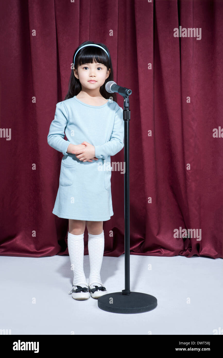 a girl performing on stage Stock Photo - Alamy
