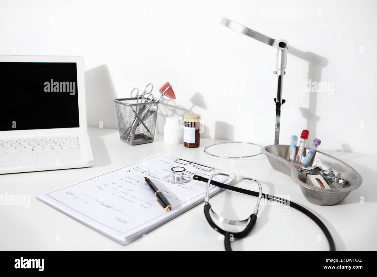 a doctors desk with a laptop Stock Photo - Alamy