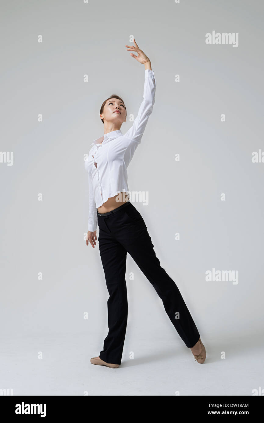 a woman making dance poses Stock Photo - Alamy