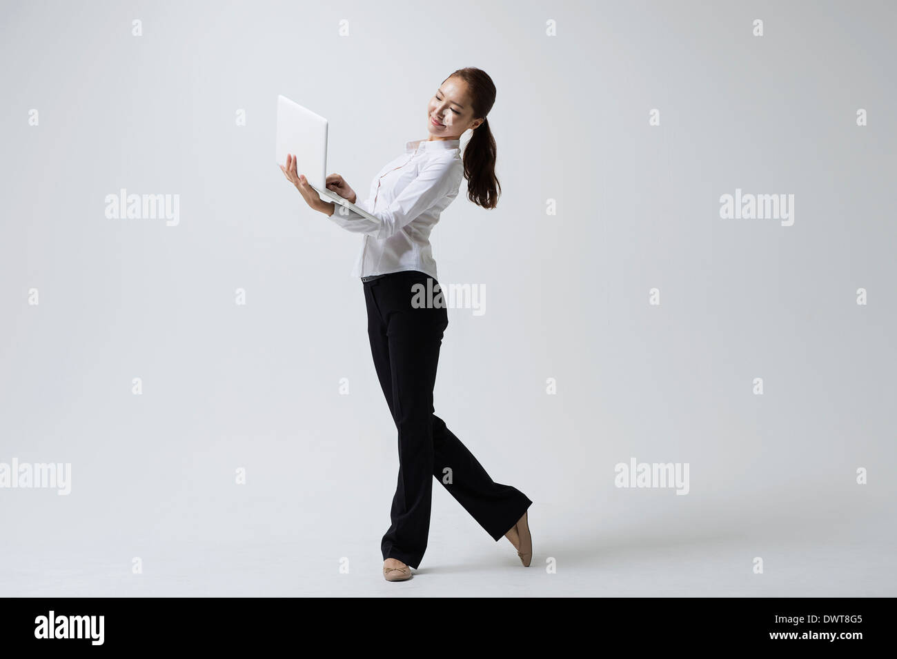 Woman making dance poses laptop hi-res stock photography and images - Alamy