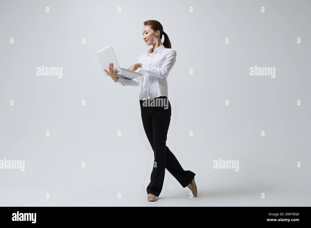 Woman making dance poses laptop hi-res stock photography and images - Alamy