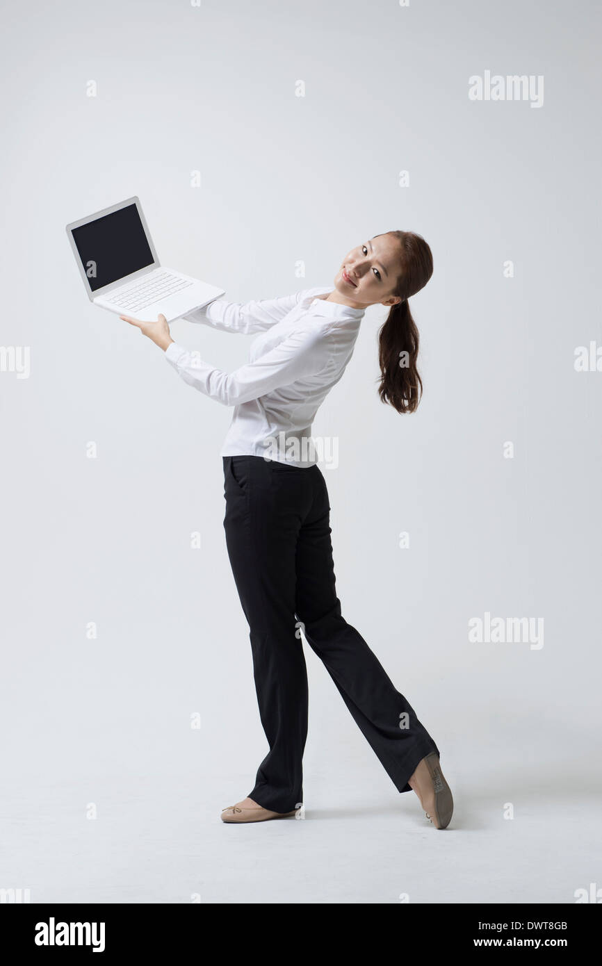 Woman making dance poses laptop hi-res stock photography and images - Alamy