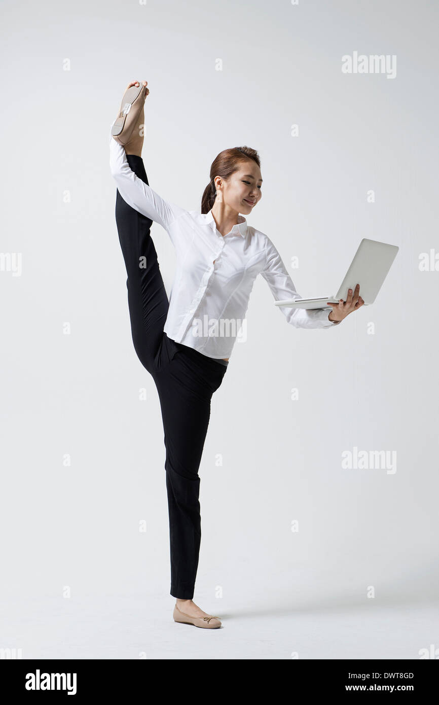 Woman making dance poses laptop hi-res stock photography and images - Alamy