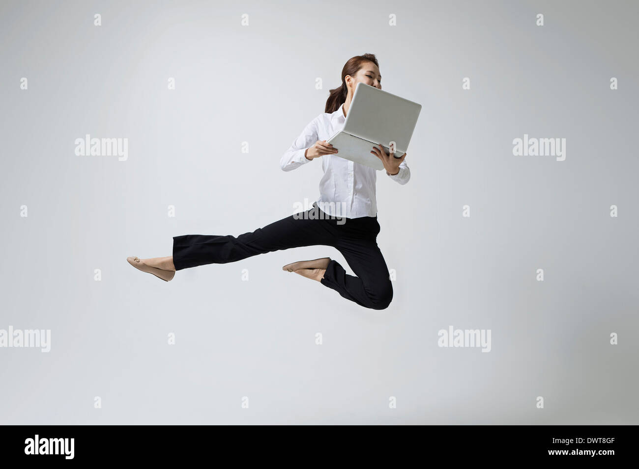 Woman making dance poses laptop hi-res stock photography and images - Alamy